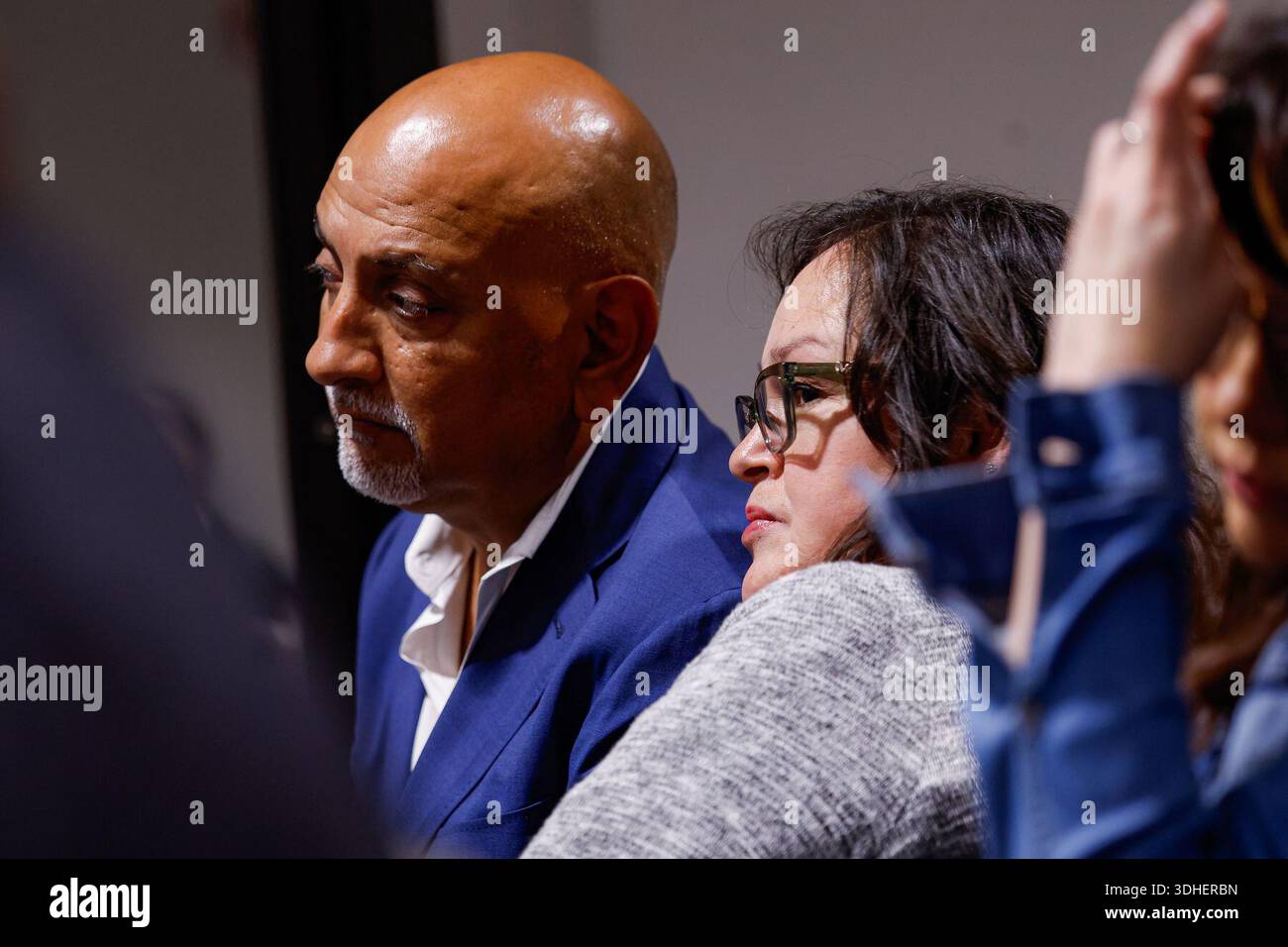 Jesse Rizo and his wife Juanita Cazares-Rizo listen to the prosecution ...