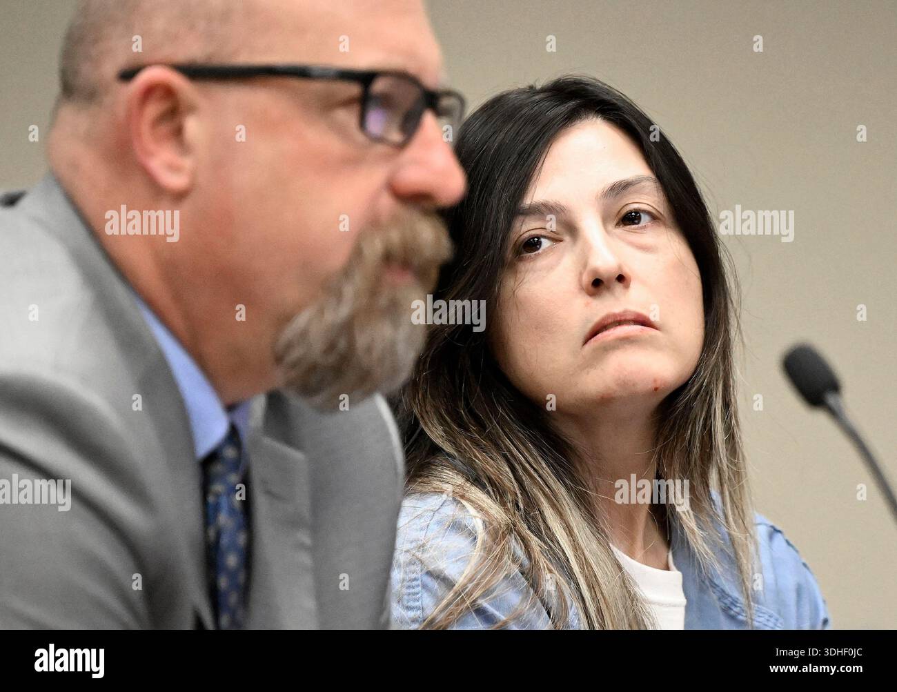 Rebecca Haro sits in court with her defense attorney Jeff Moore inside ...