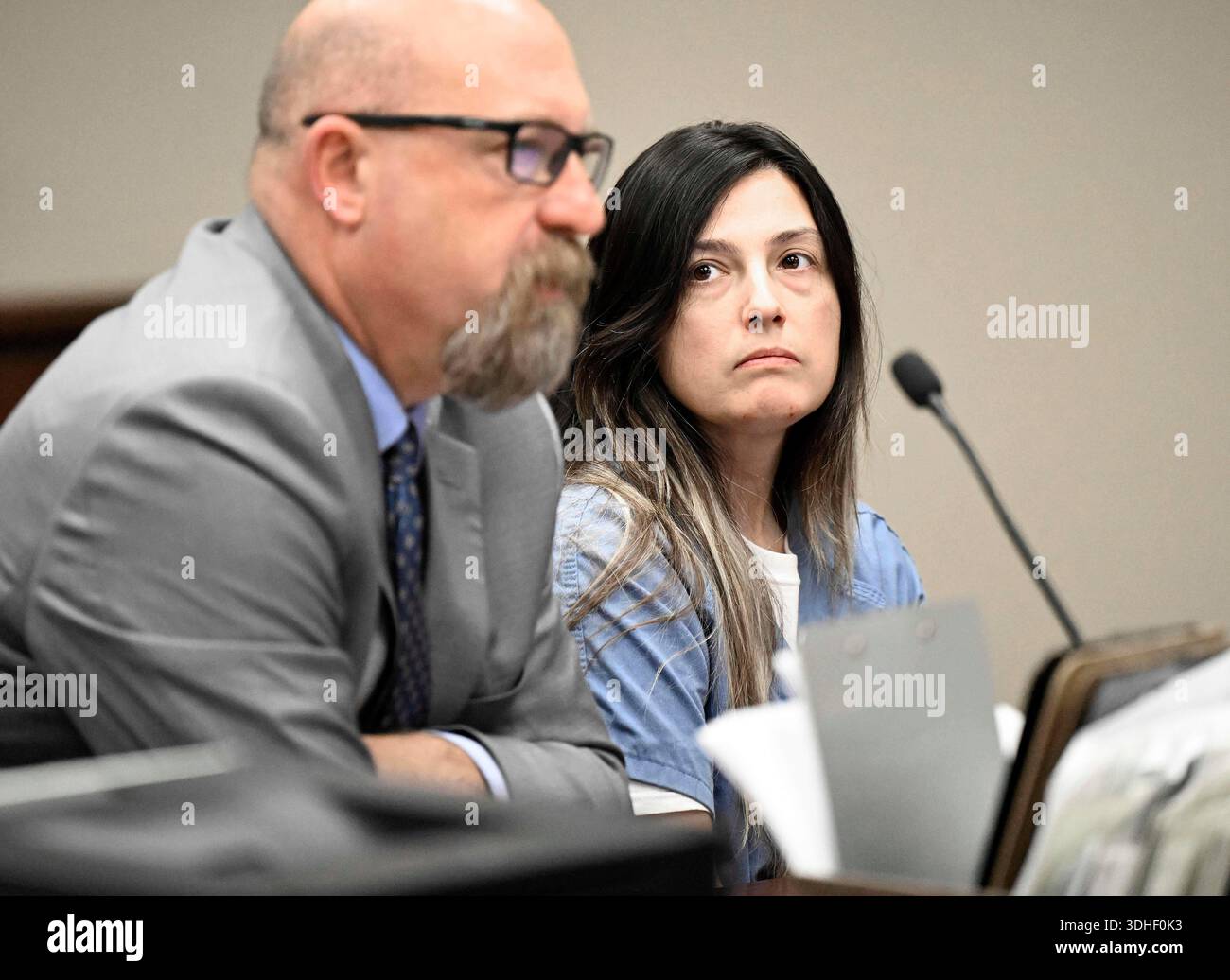 Rebecca Haro sits in court with her defense attorney Jeff Moore inside ...