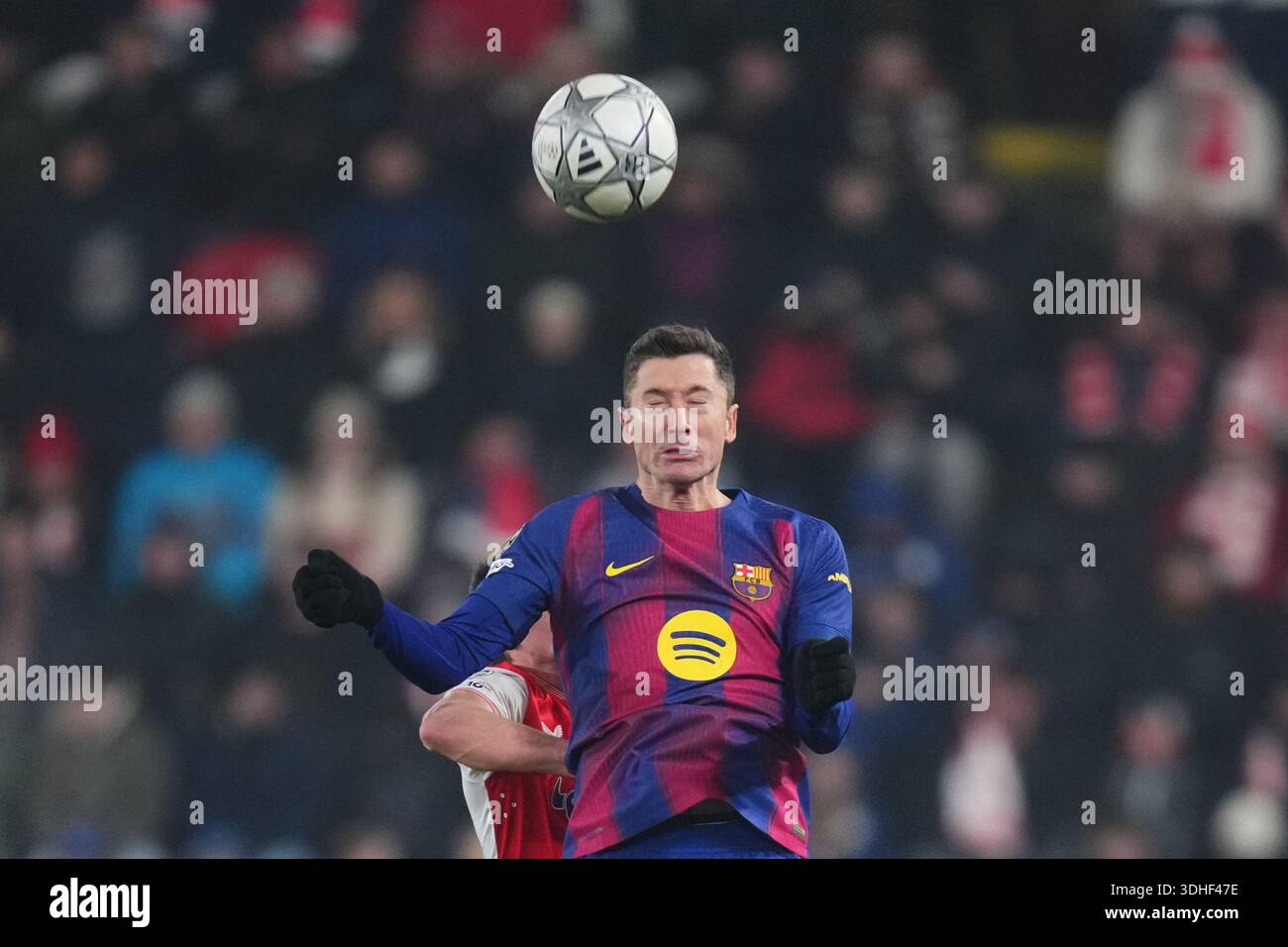 Barcelona's Robert Lewandowski heads the ball during the Champions ...