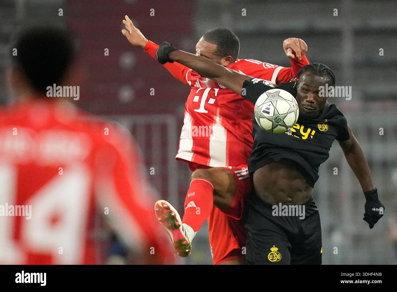 Bayern's Jonathan Tah, center, and Union SG's Promise David challenge ...