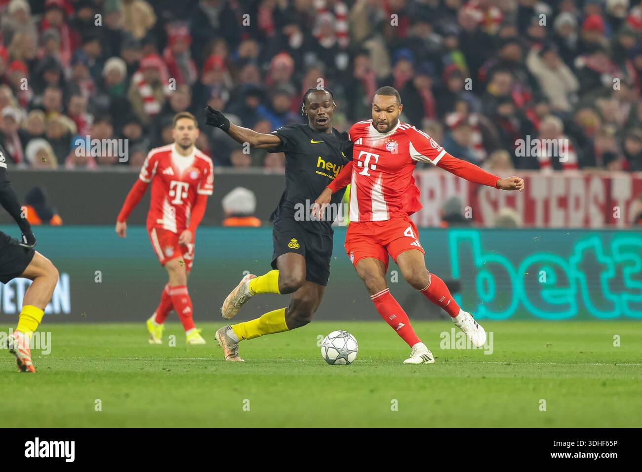 Jonathan Tah (FC FC Bayern Munich, #04) with Promise David (Royale ...