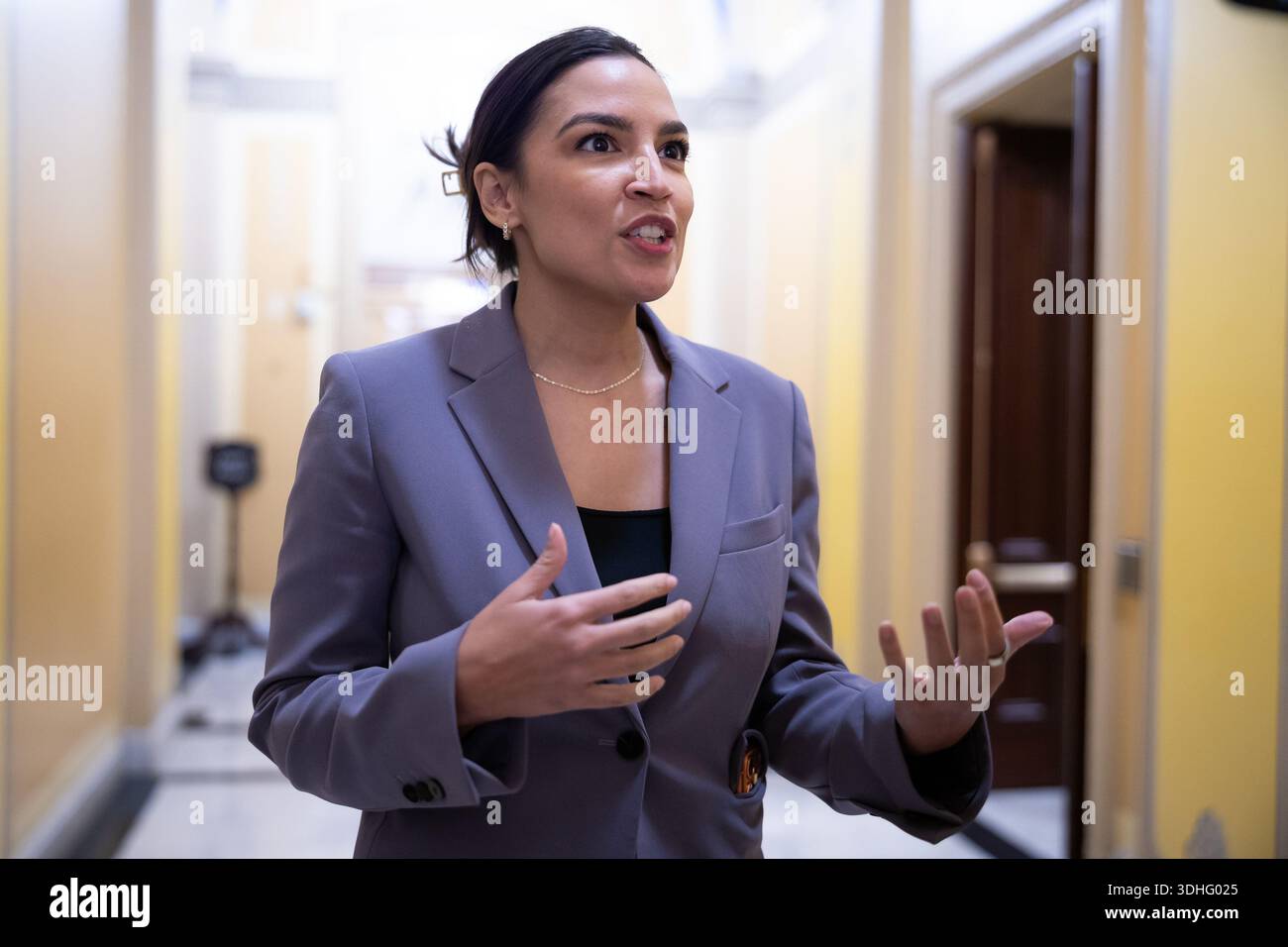 Rep. Alexandria Ocasio-Cortez (D-N.Y.) speaks with a reporter as she ...
