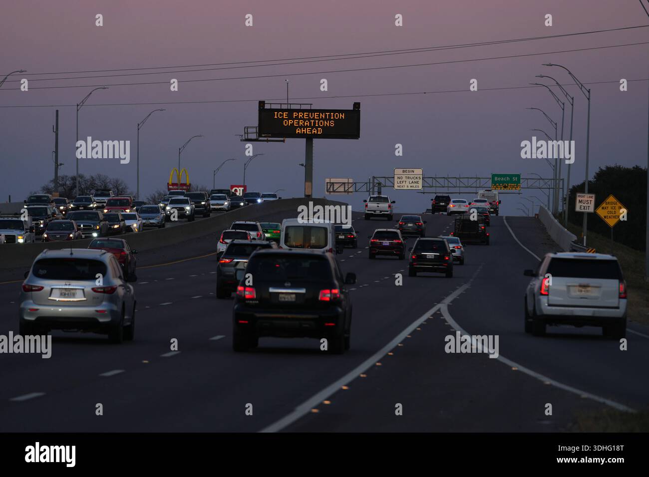 A sign visible from the eastbound lanes of Highway 121 warns of road ...