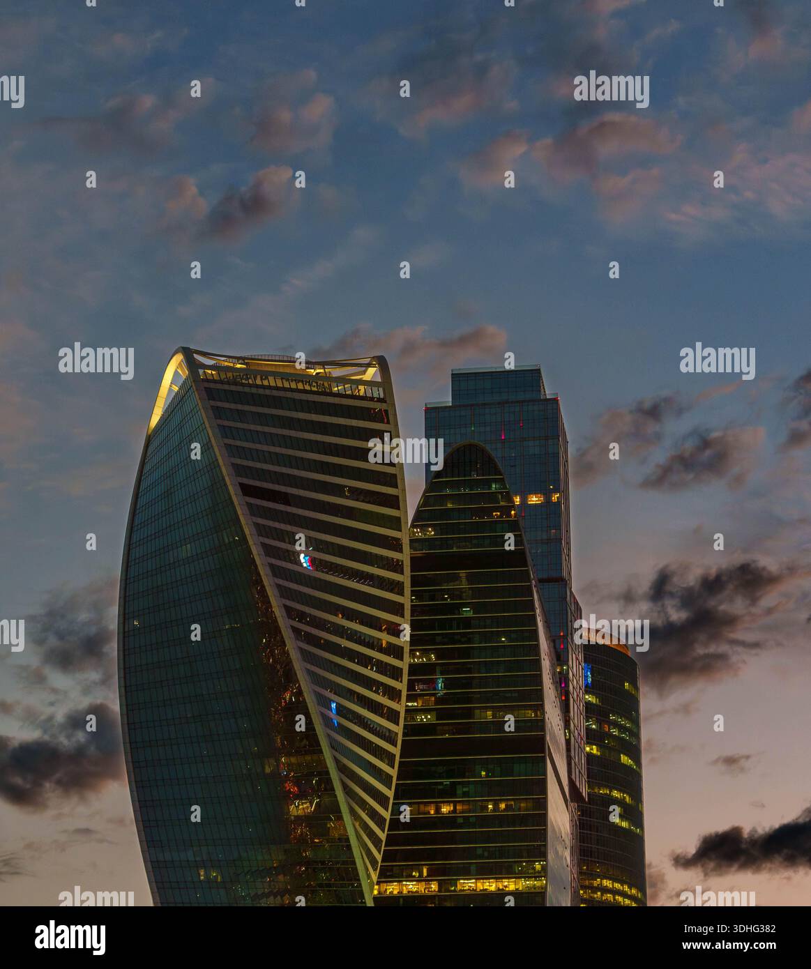 Modern glass towers in Moscow City during sunset. Twisting architecture ...