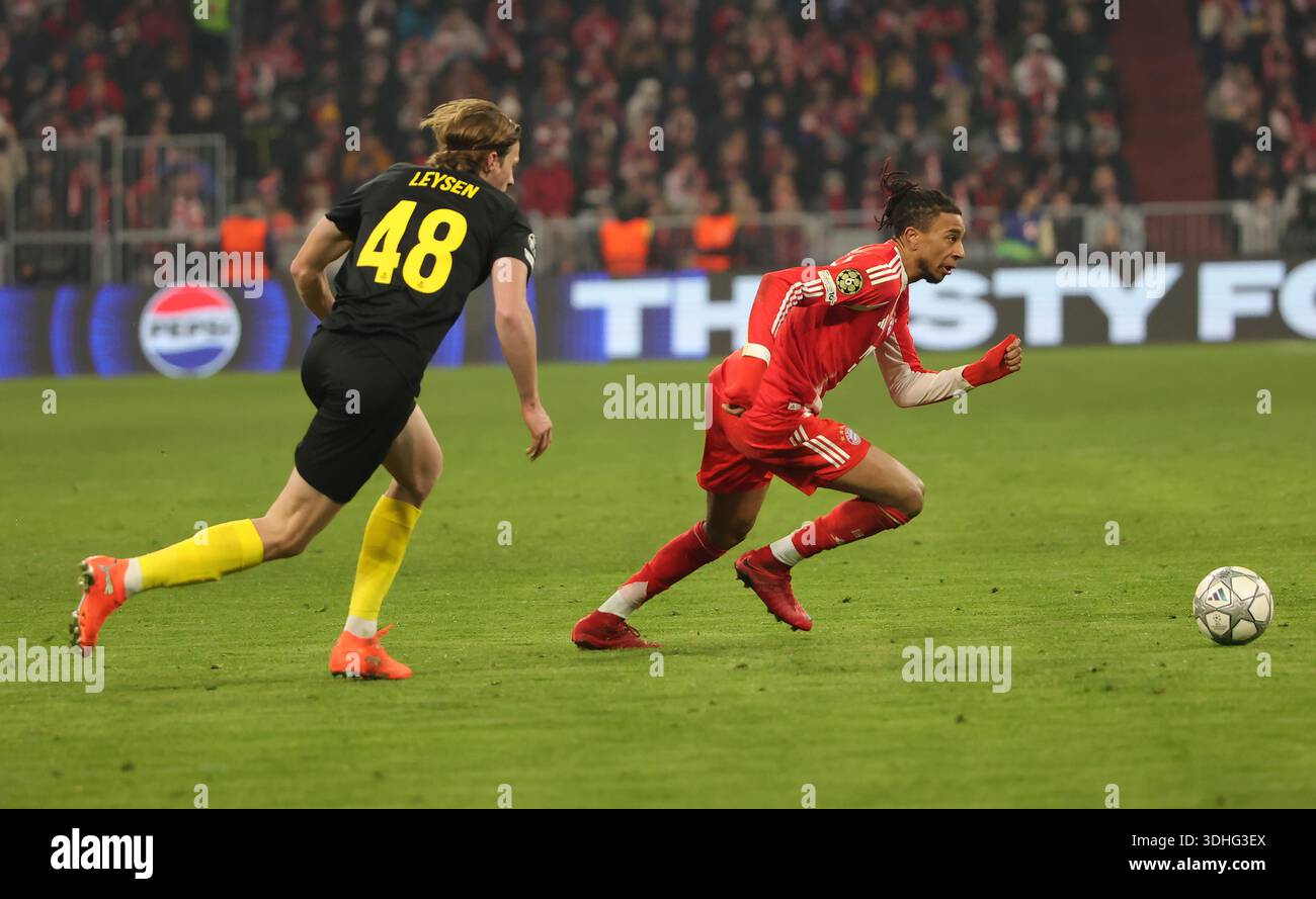 Munich, Germany. 21st Jan, 2026. Michael Olise (R) of Bayern Munich ...