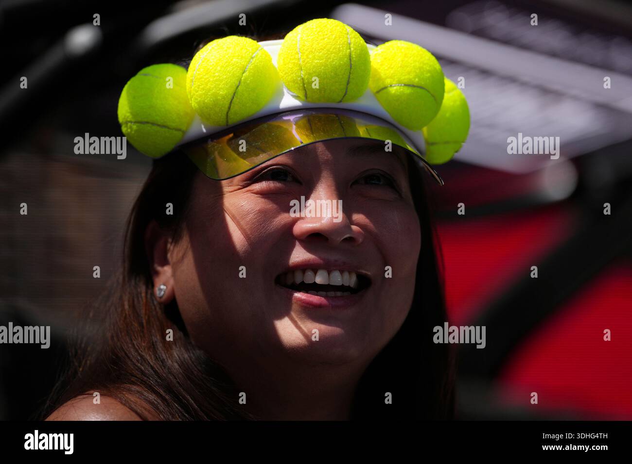 A fan watches second round matches at the Australian Open tennis ...