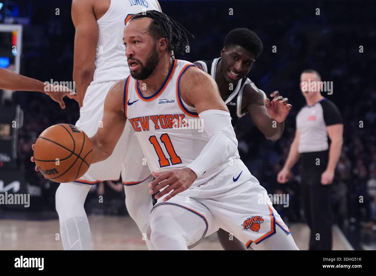 New York Knicks' Jalen Brunson (11) drives past Brooklyn Nets' Drake ...