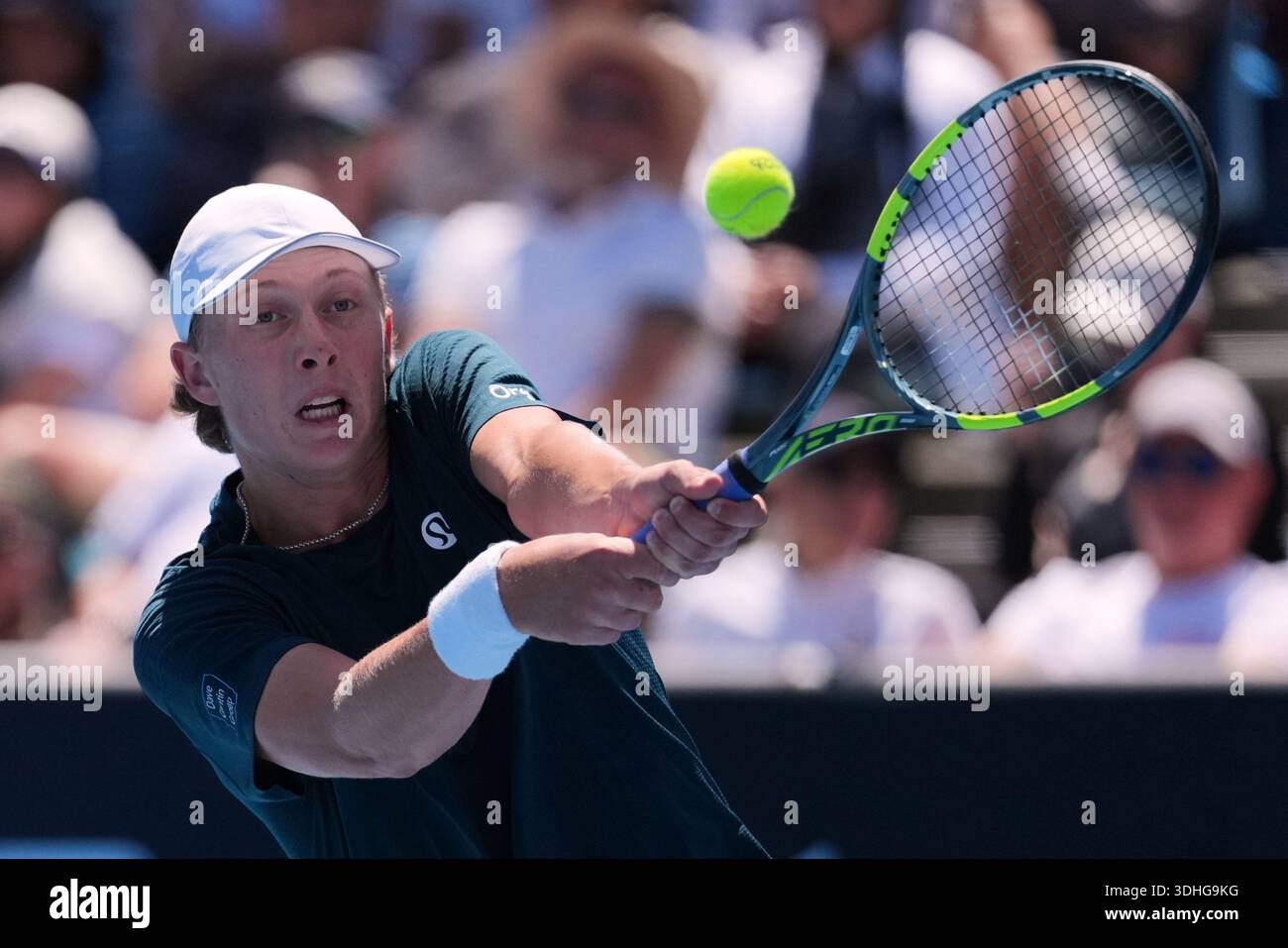 Ethan Quinn of the U.S. plays a backhand return to Hubert Hurkacz of ...