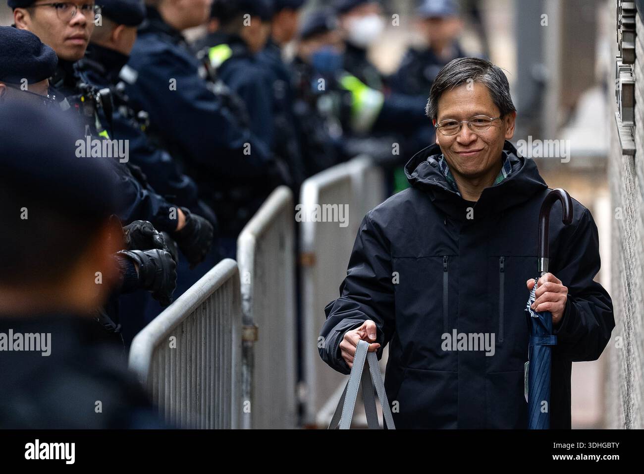 Pro-democracy activist Tang Ngok-kwan enters the West Kowloon ...