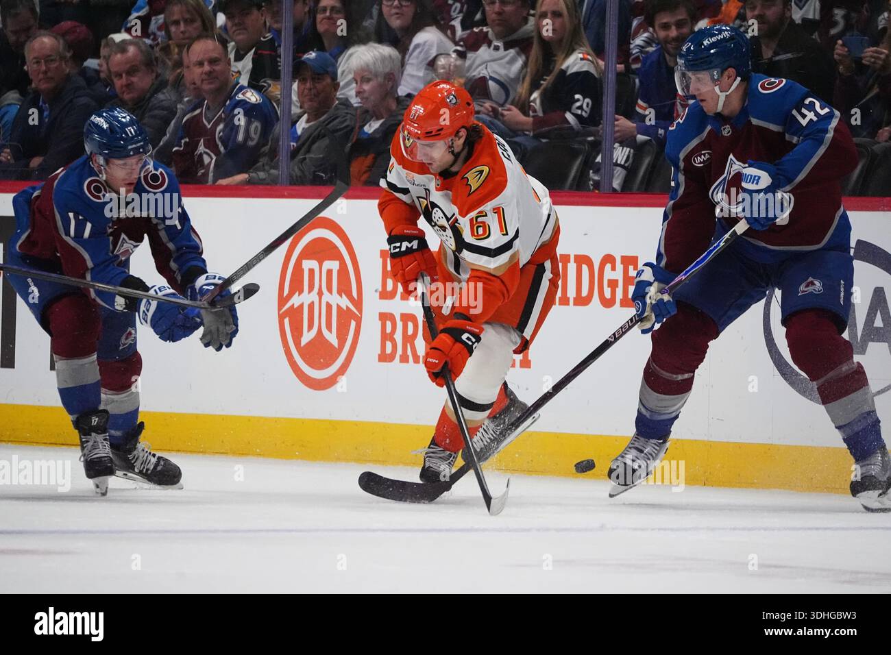 Anaheim Ducks left wing Cutter Gauthier, center, passes the puck while ...