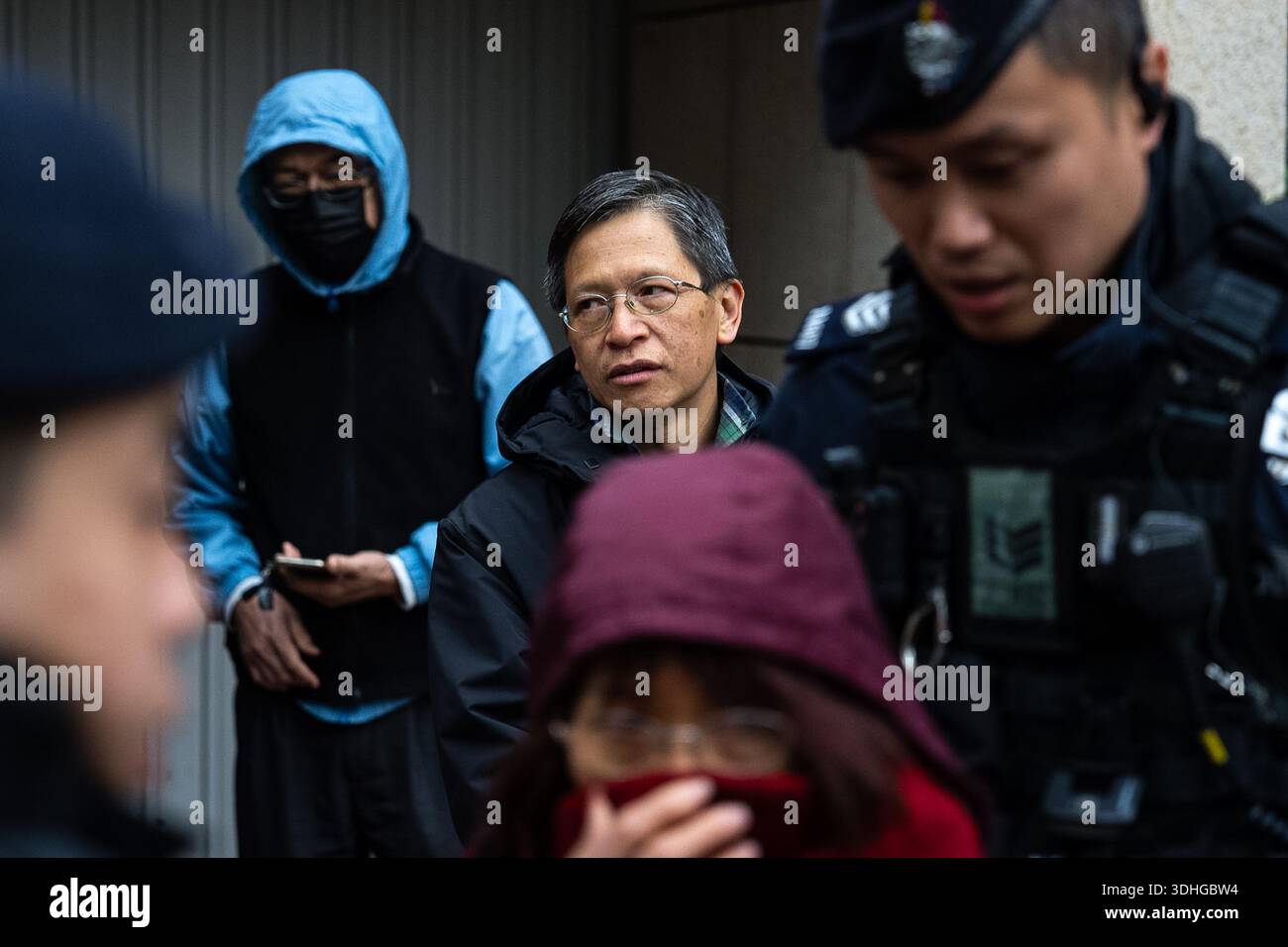 Pro-democracy activist Tang Ngok-kwan waits outside the West Kowloon ...