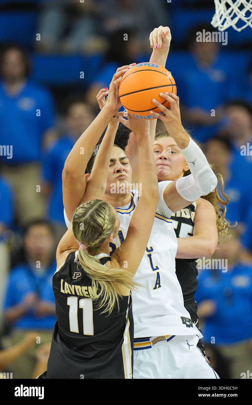 UCLA center Lauren Betts (51) is defended by Purdue guard McKenna ...