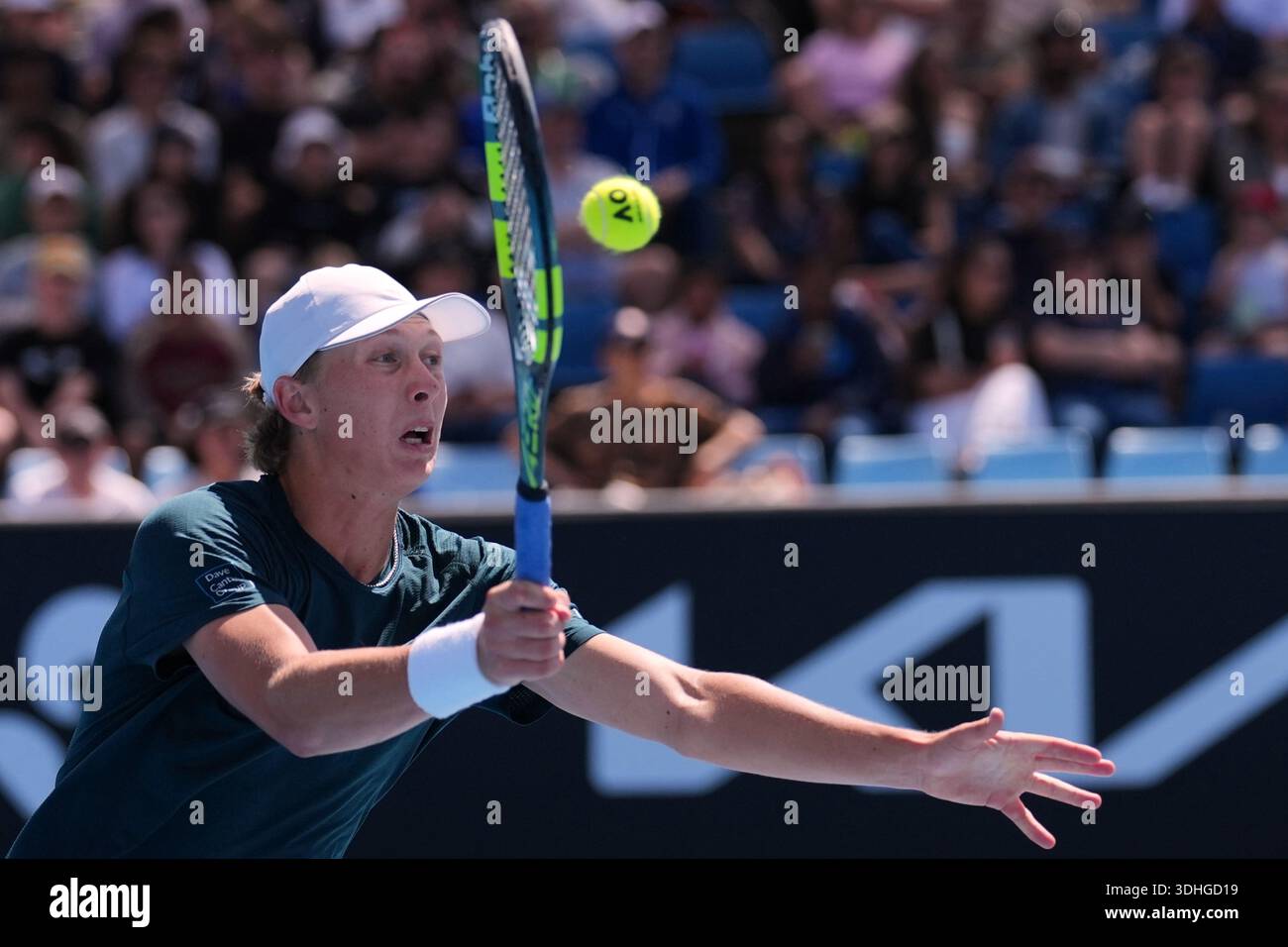 Ethan Quinn of the U.S. plays a forehand return to Hubert Hurkacz of ...