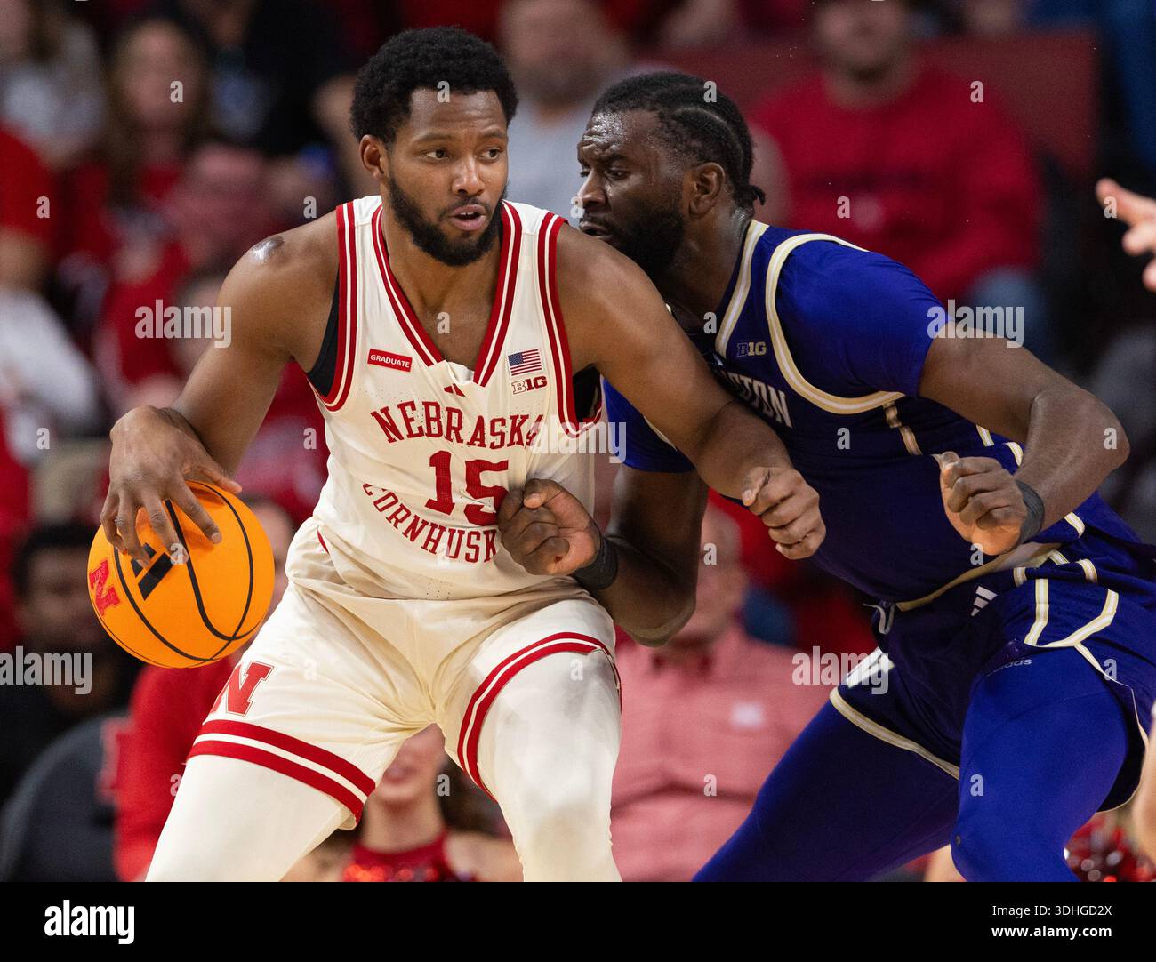 Nebraska's Jared Garcia, left, drives against Washington's Franck ...