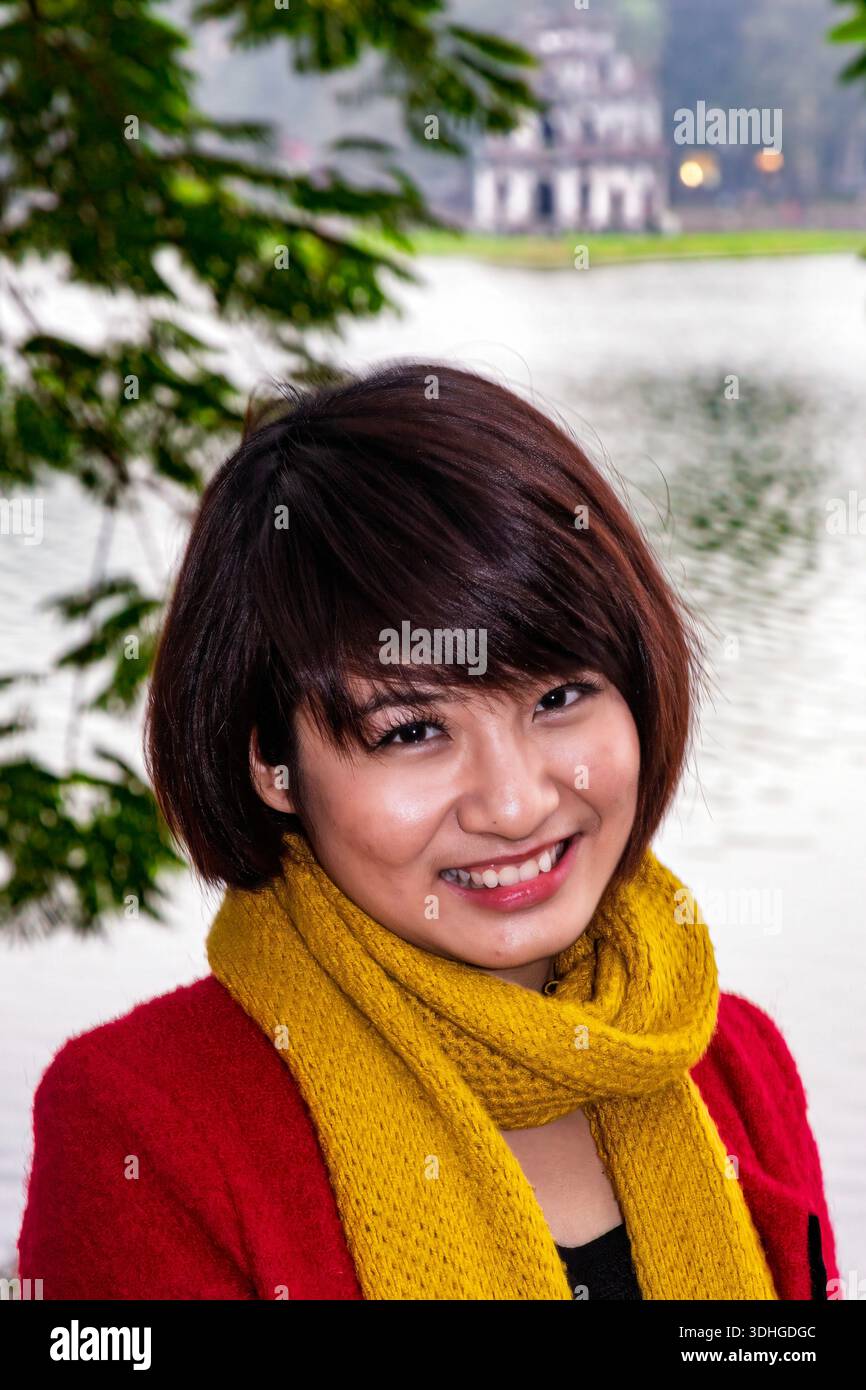 Attractive Vietnamese model posing beside Turtle Tower, Hoan Kiem lake ...