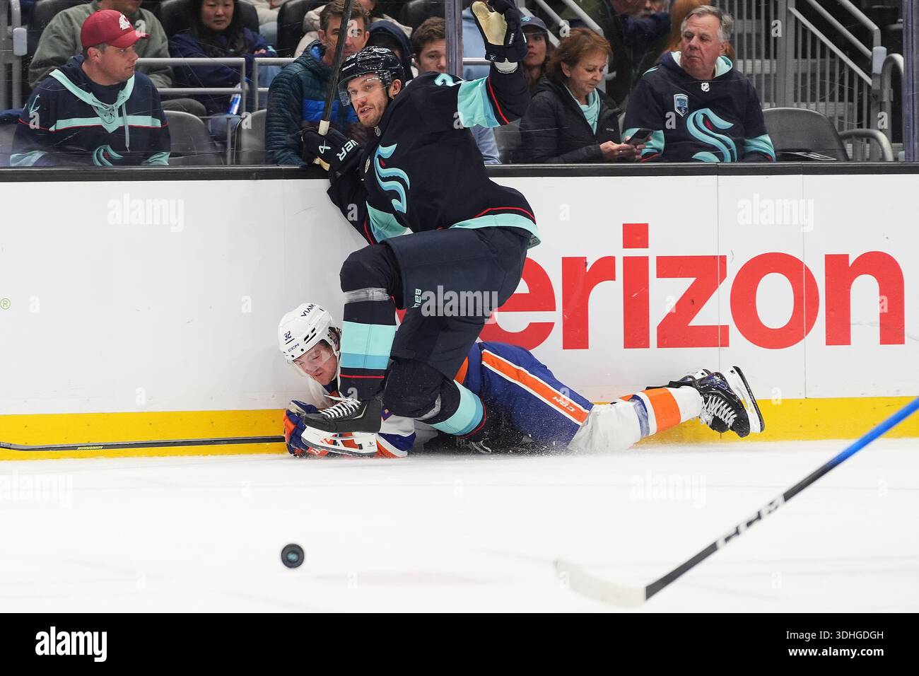 New York Islanders center Kyle MacLean falls against Seattle Kraken ...