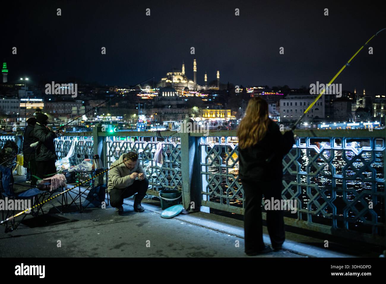 Istanbul, Turkey. 21st Jan, 2026. People seen fishing on the Galata ...