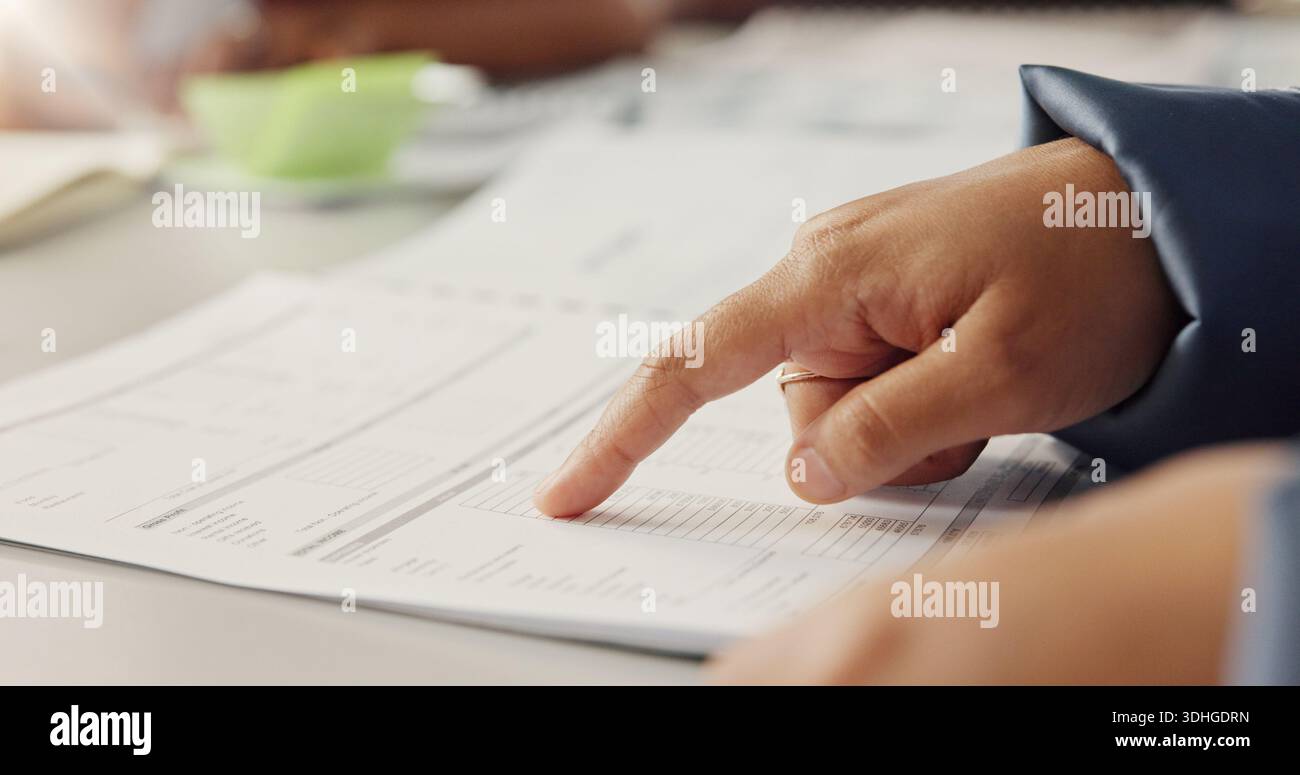Accountant, hands and paperwork at desk for review, check balance sheet ...