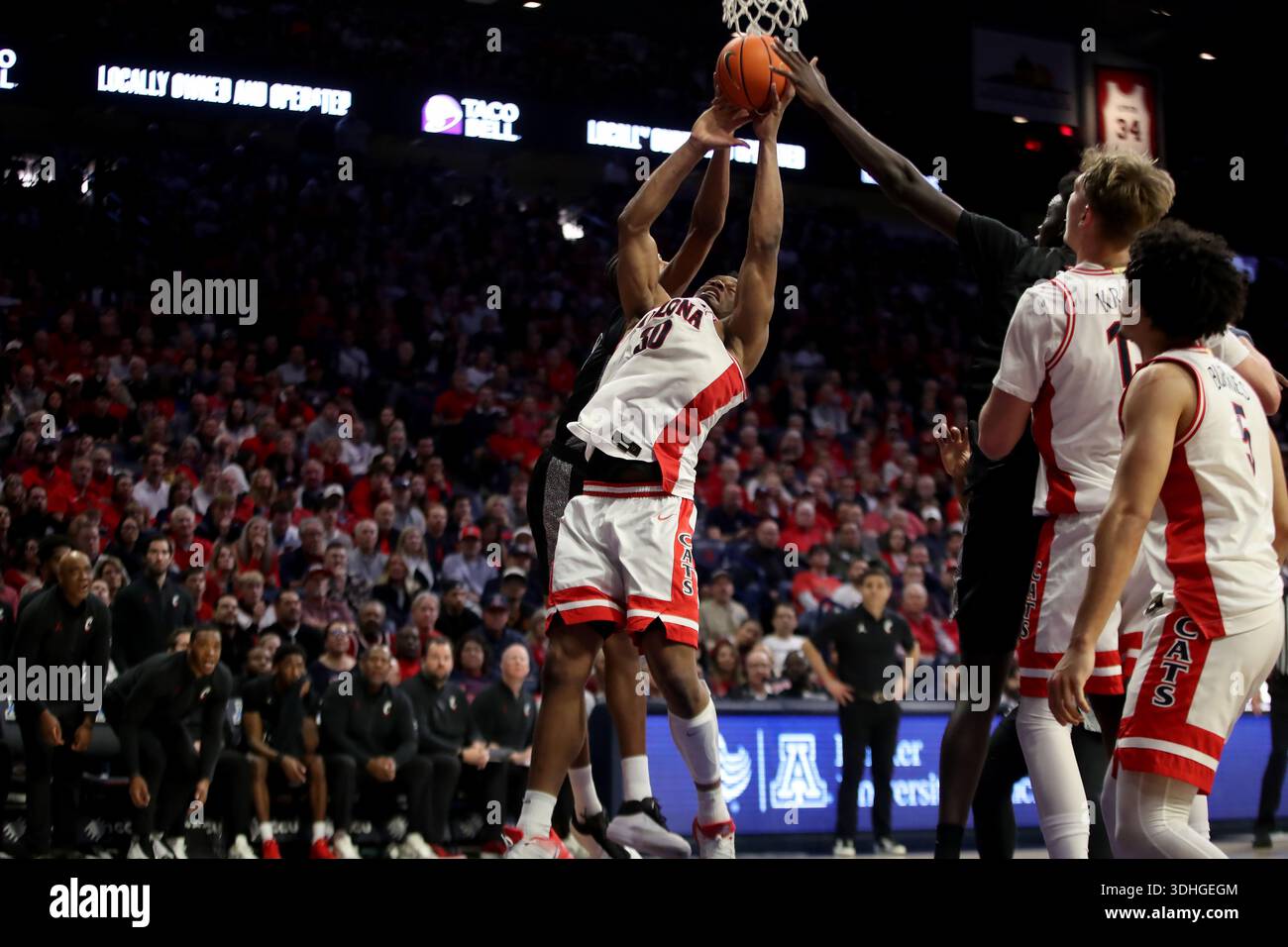 TUCSON, AZ - JANUARY 21: Arizona Wildcats forward Tobe Awaka (30) grabs ...