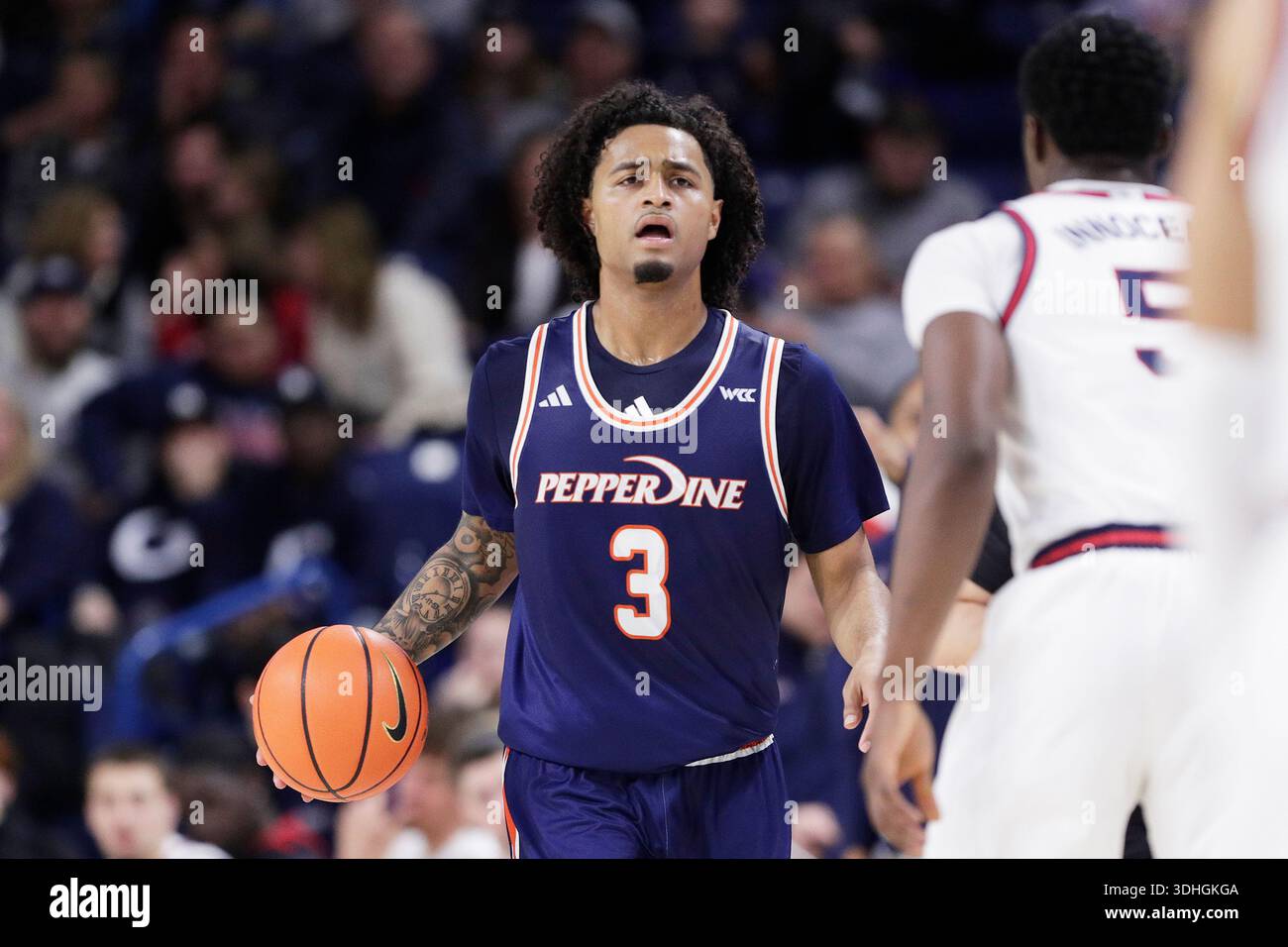 Pepperdine guard Aaron Clark (3) controls the ball during the second ...