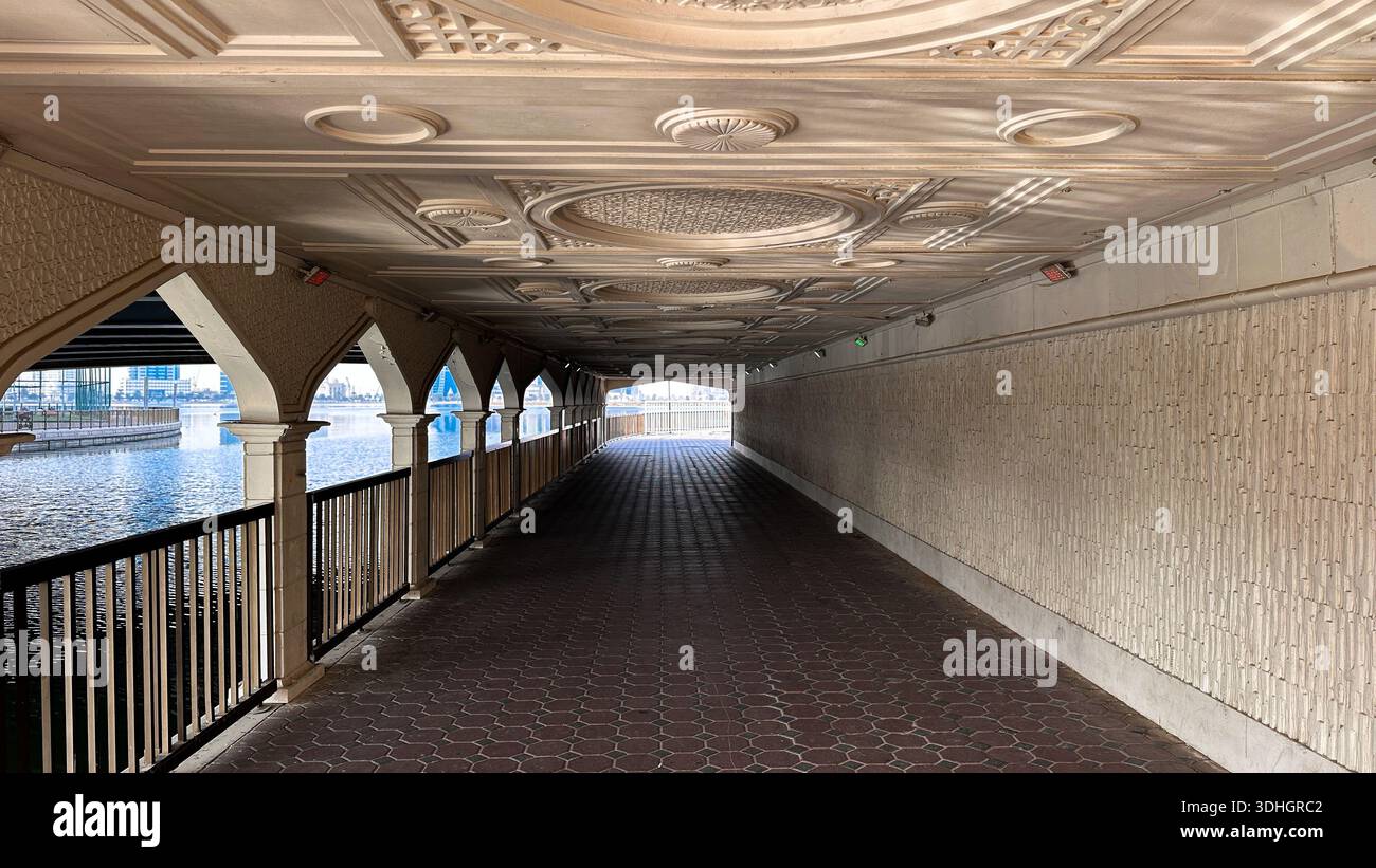 Symmetrical pedestrian passage under city structure. Modern urban ...