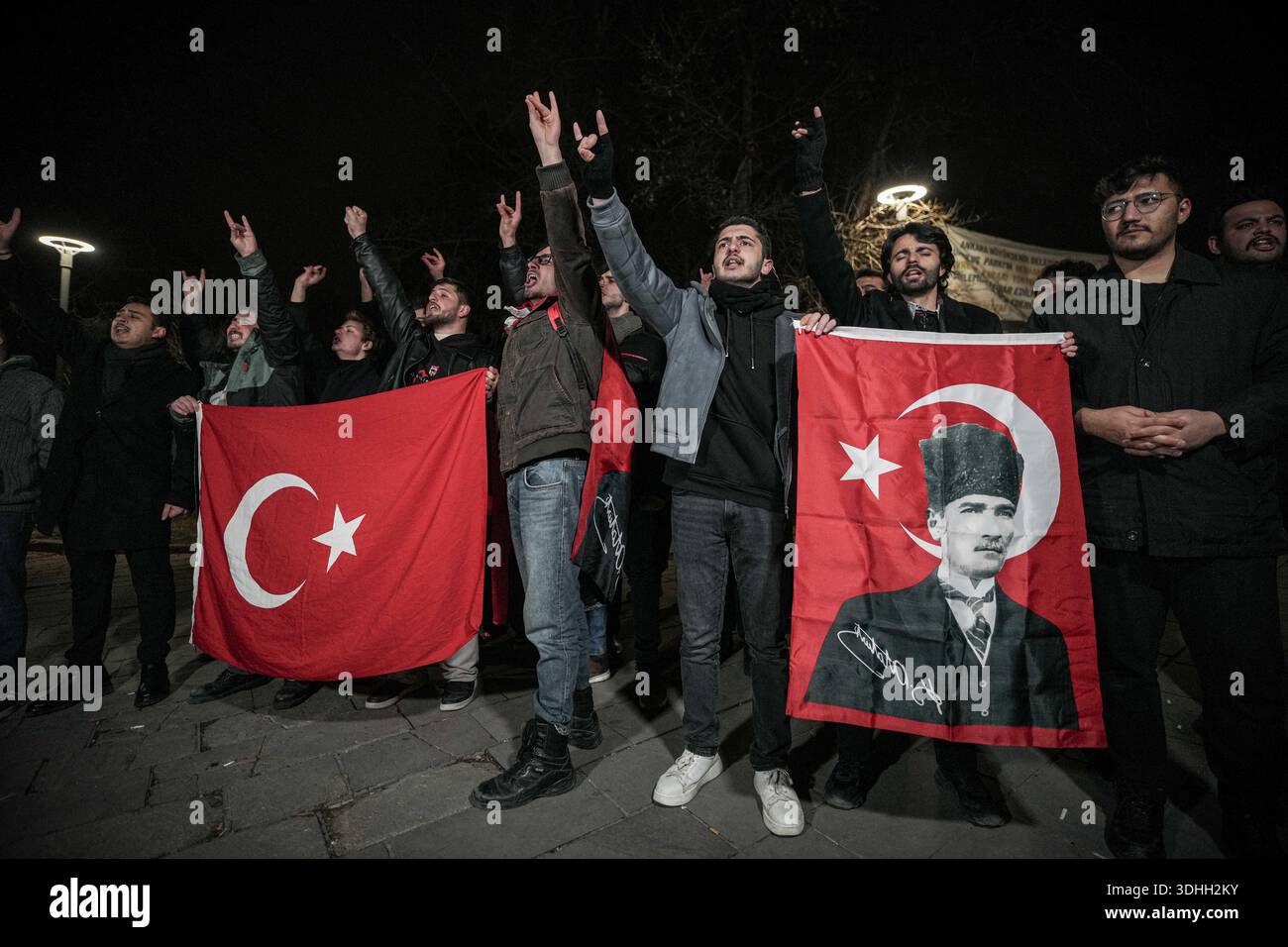 Ankara, Turkey. 21st Jan, 2026. Protesters raise the Turkish flag as ...