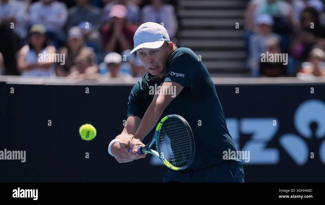 Ethan Quinn of the U.S. plays a backhand return to Hubert Hurkacz of ...
