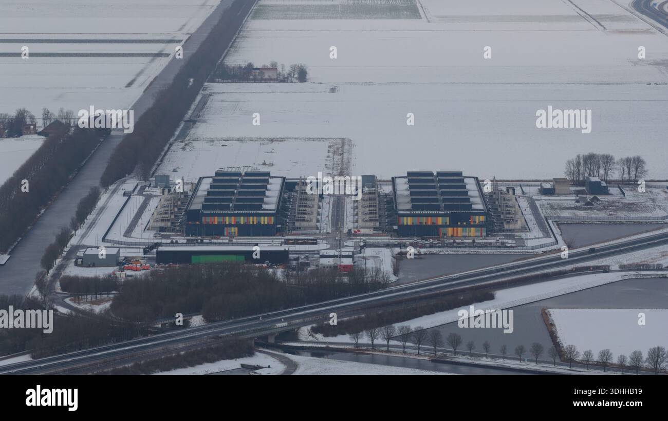 Aerial view of the symmetrical datacenter reflecting the winter light ...