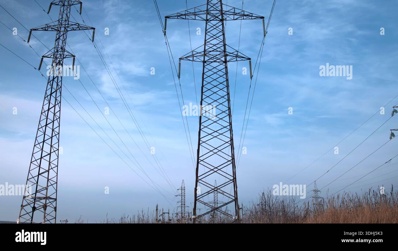 Tall Towers Stretch Across Sky, Metal Lattice Structures Stand Tall ...