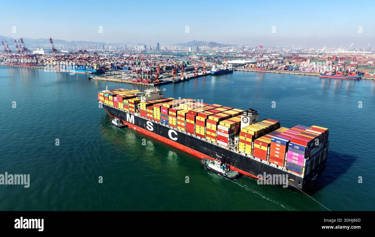 An MSC container ship sails into the harbor in Qingdao in eastern China ...