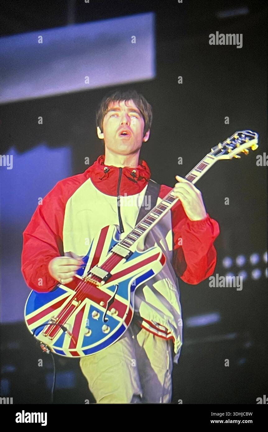 Noel Gallagher of Oasis playing live on stage at Maine Road Stadium ...