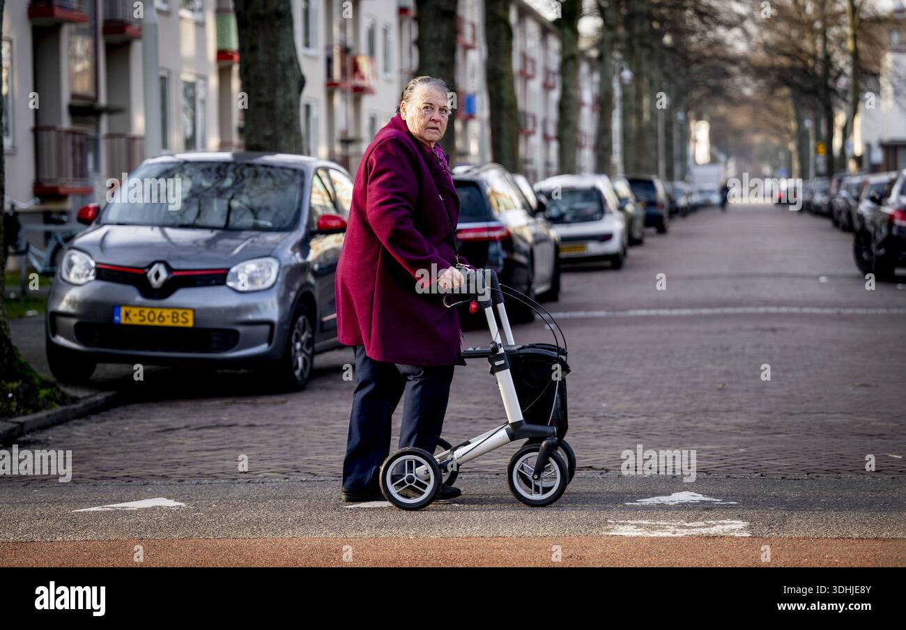 THE HAGUE - An elderly woman with a walker on the street ROBIN UTRECHT ...