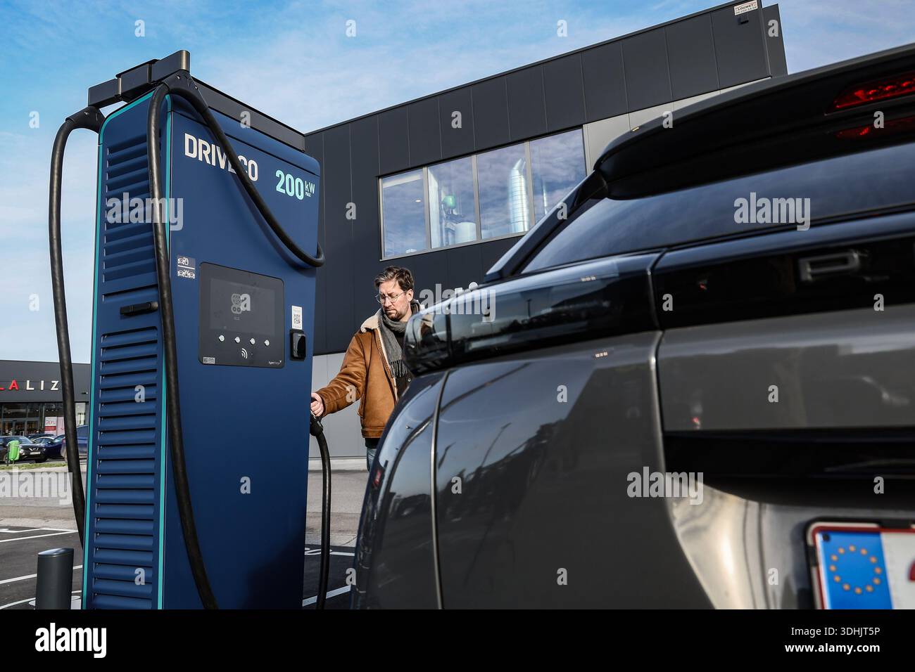 Hannut, Belgium. 22nd Jan, 2026. An electric vehicle charges at the ...