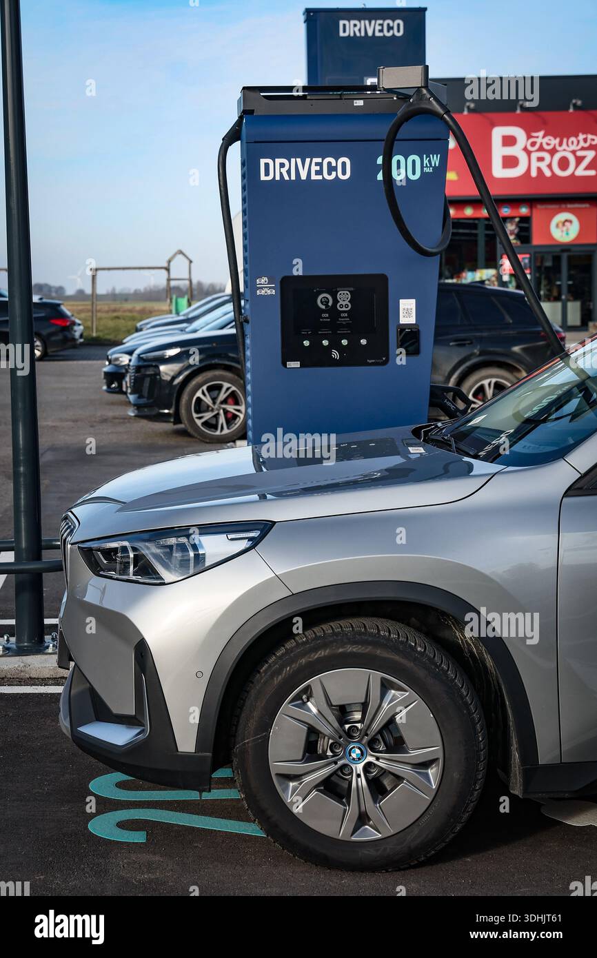 Hannut, Belgium. 22nd Jan, 2026. An electric vehicle charges at the ...