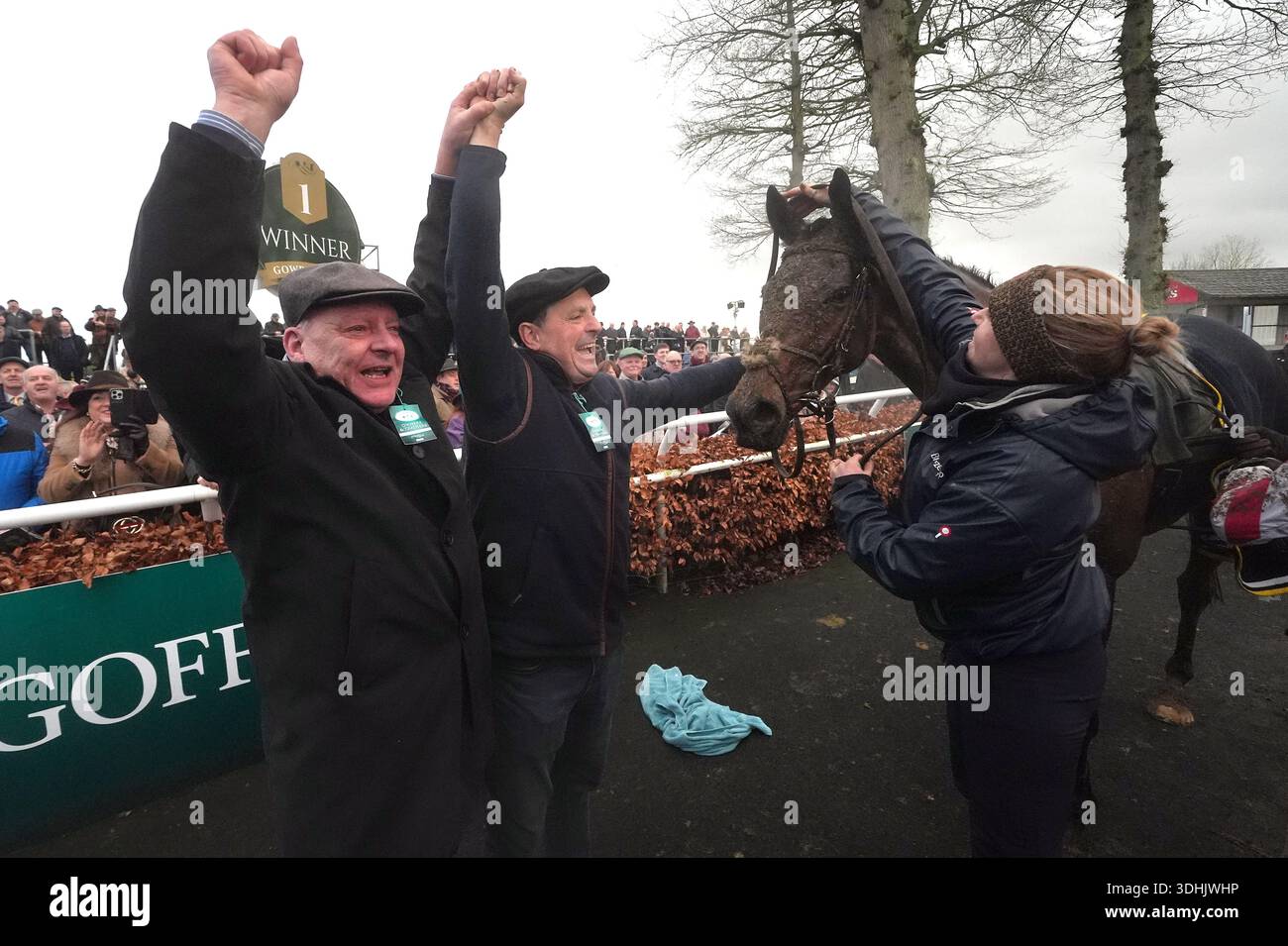 The winning entourage celebrates after seeing jockey Eoin Staples win ...