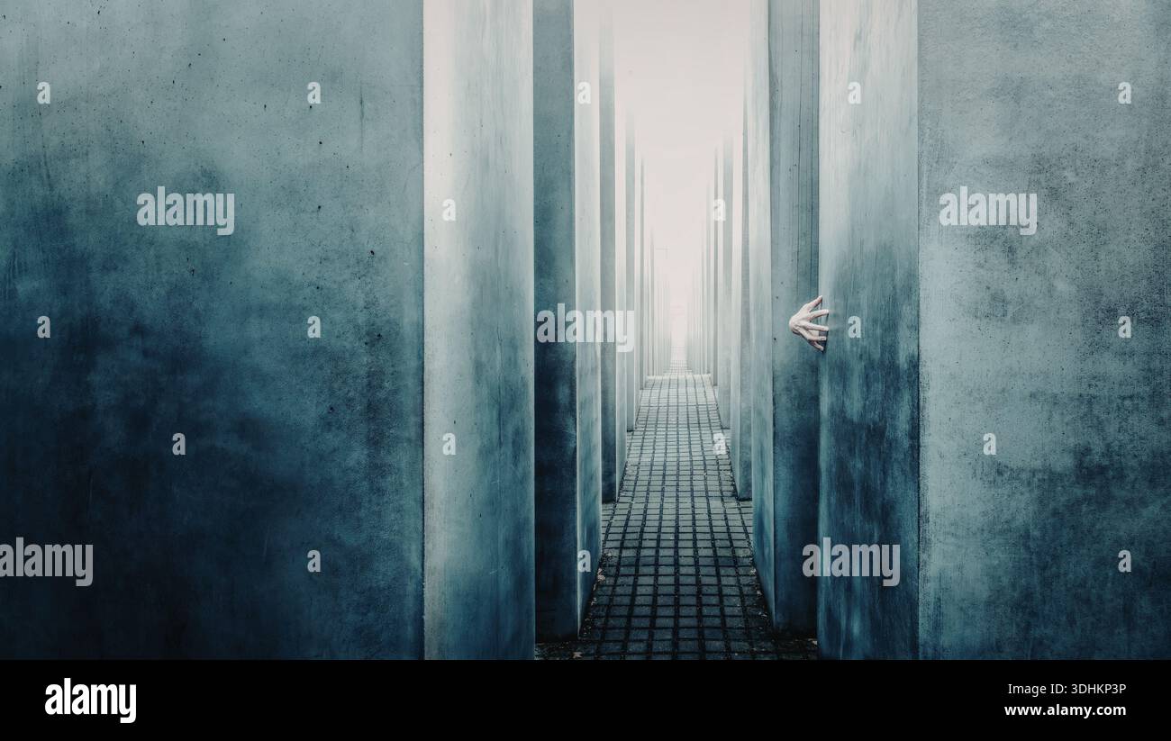 A long, narrow pathway flanked by tall, grey concrete columns. The ...