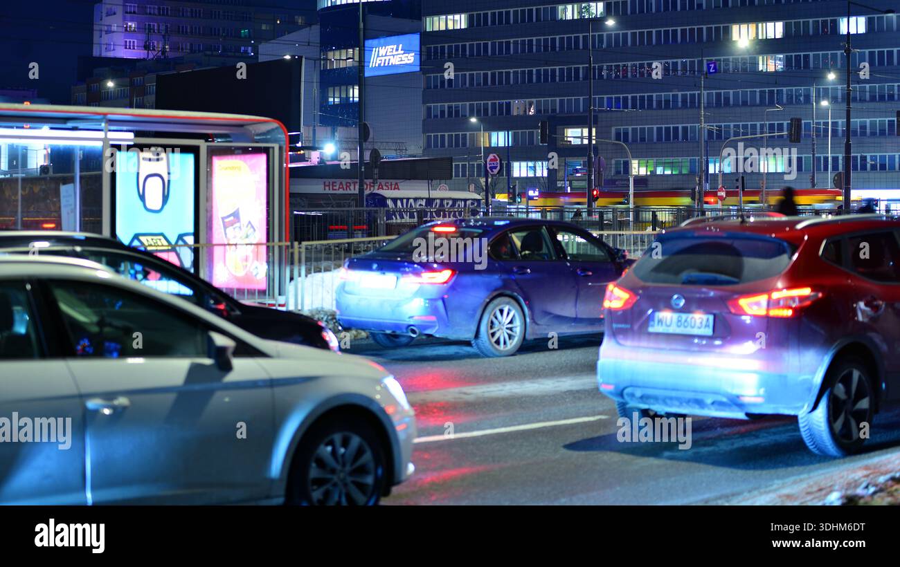 Warsaw, Poland. 21 January 2026. City life after dark. Traffic with ...