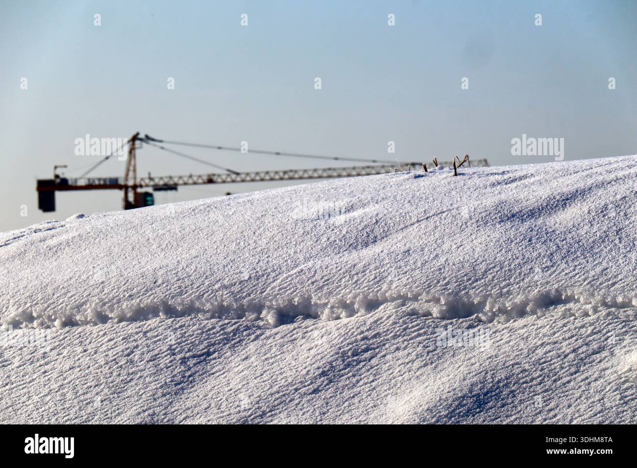 Industrial crane behind snow hi-res stock photography and images - Alamy