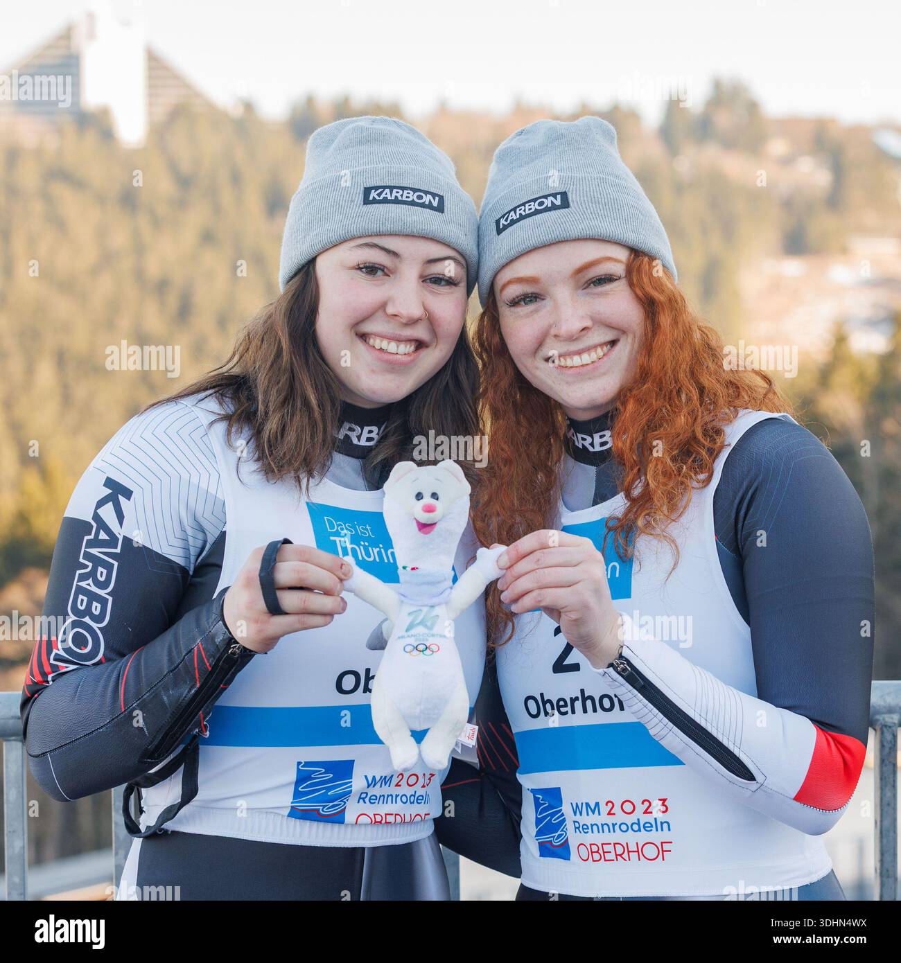 from left: Beattie Podulsky, Kailey Allan (CAN) with mascot 'Tina' of ...