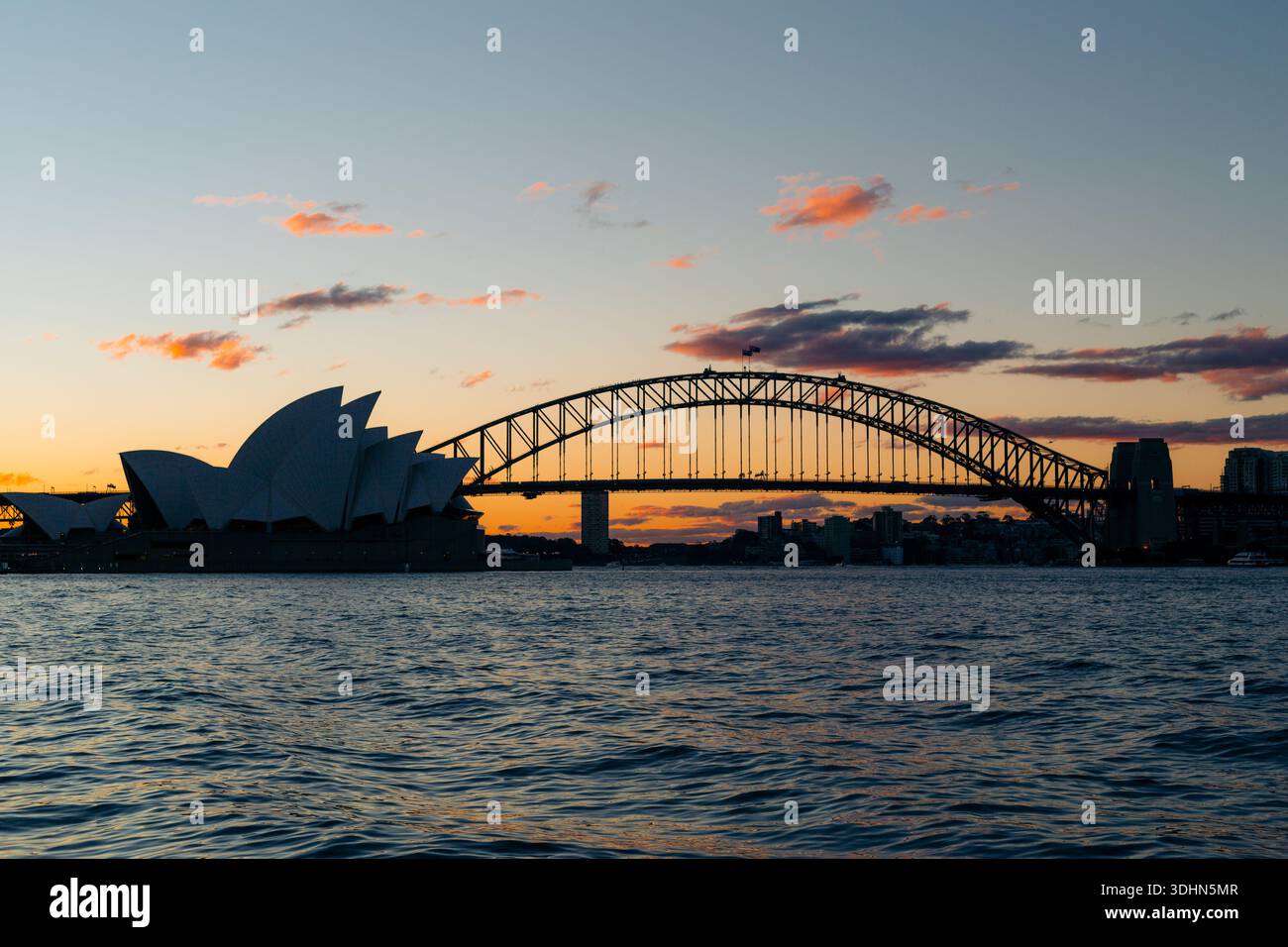 Sydney, iconic landmarks of Australia at sunset Stock Photo - Alamy