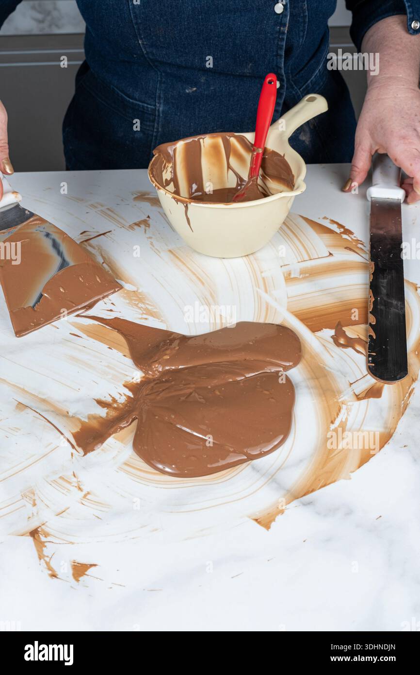 Confectioner tempering chocolate on marble hi-res stock photography and ...