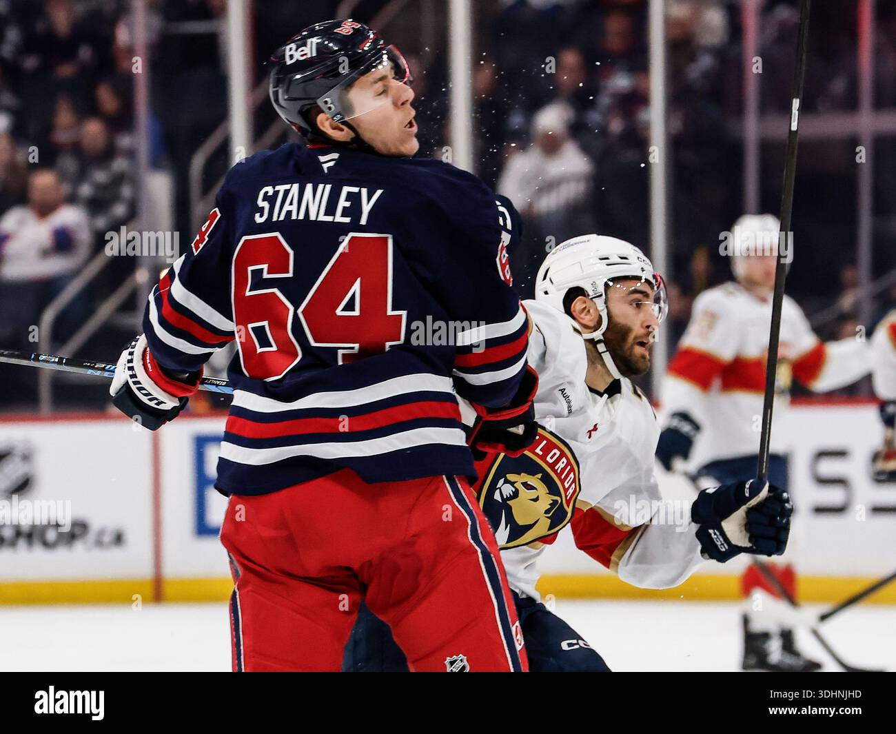 Winnipeg Jets' Logan Stanley (64) defends against Florida Panthers ...