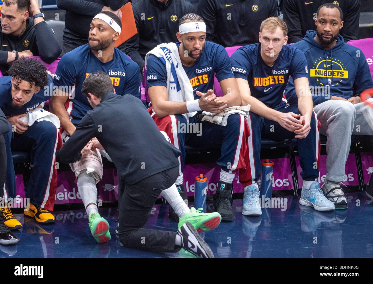 WASHINGTON, DC - JANUARY 22: Injured Nuggets players get treatment on ...