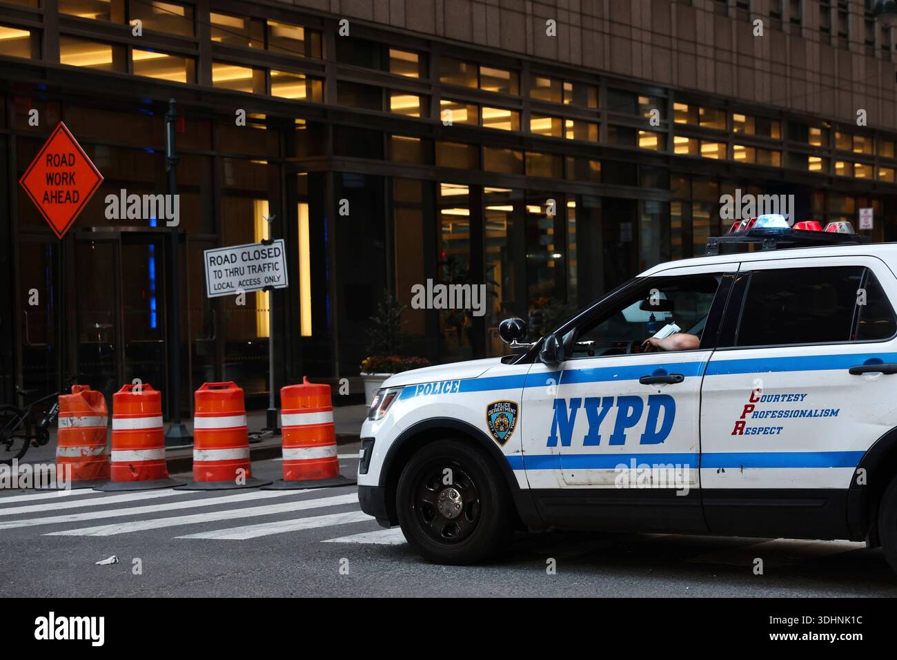 FILE - An NYPD cruiser sits at the intersection of a Midtown street ...