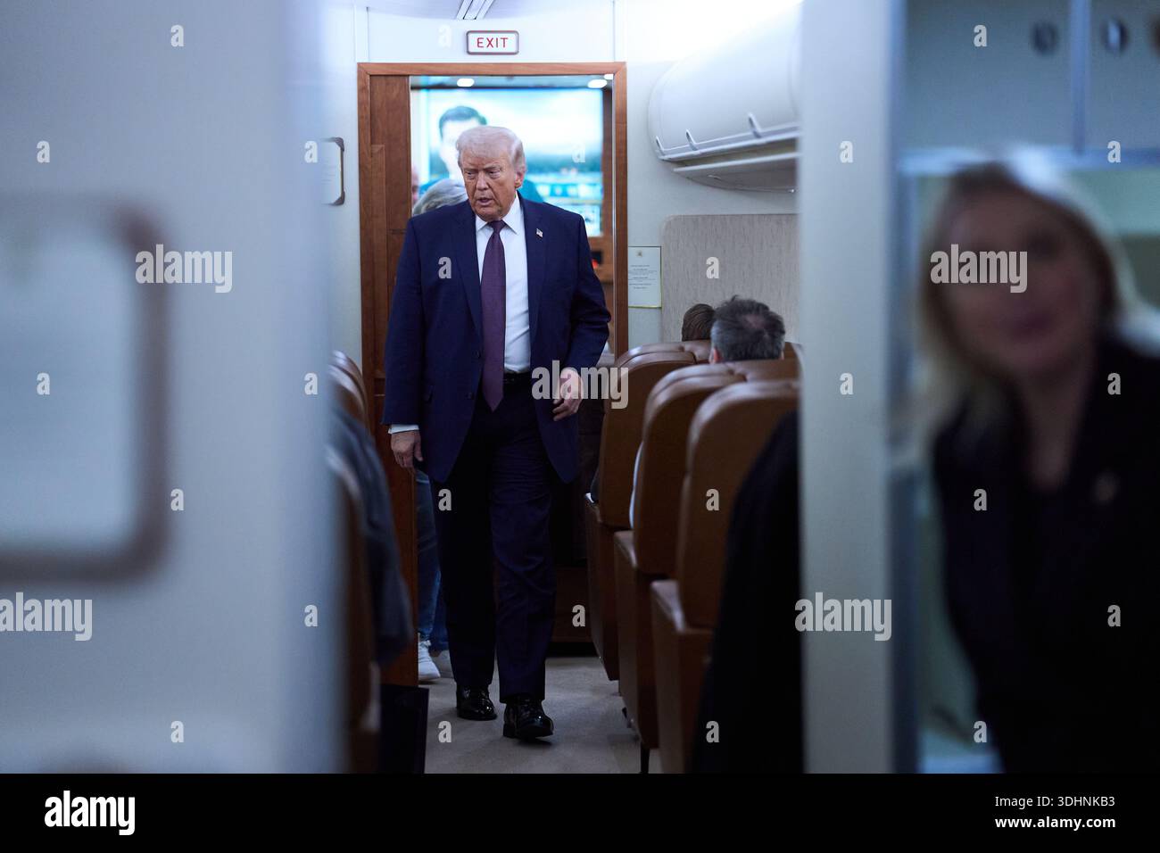 President Donald Trump walks to speak with reporters aboard Air Force ...