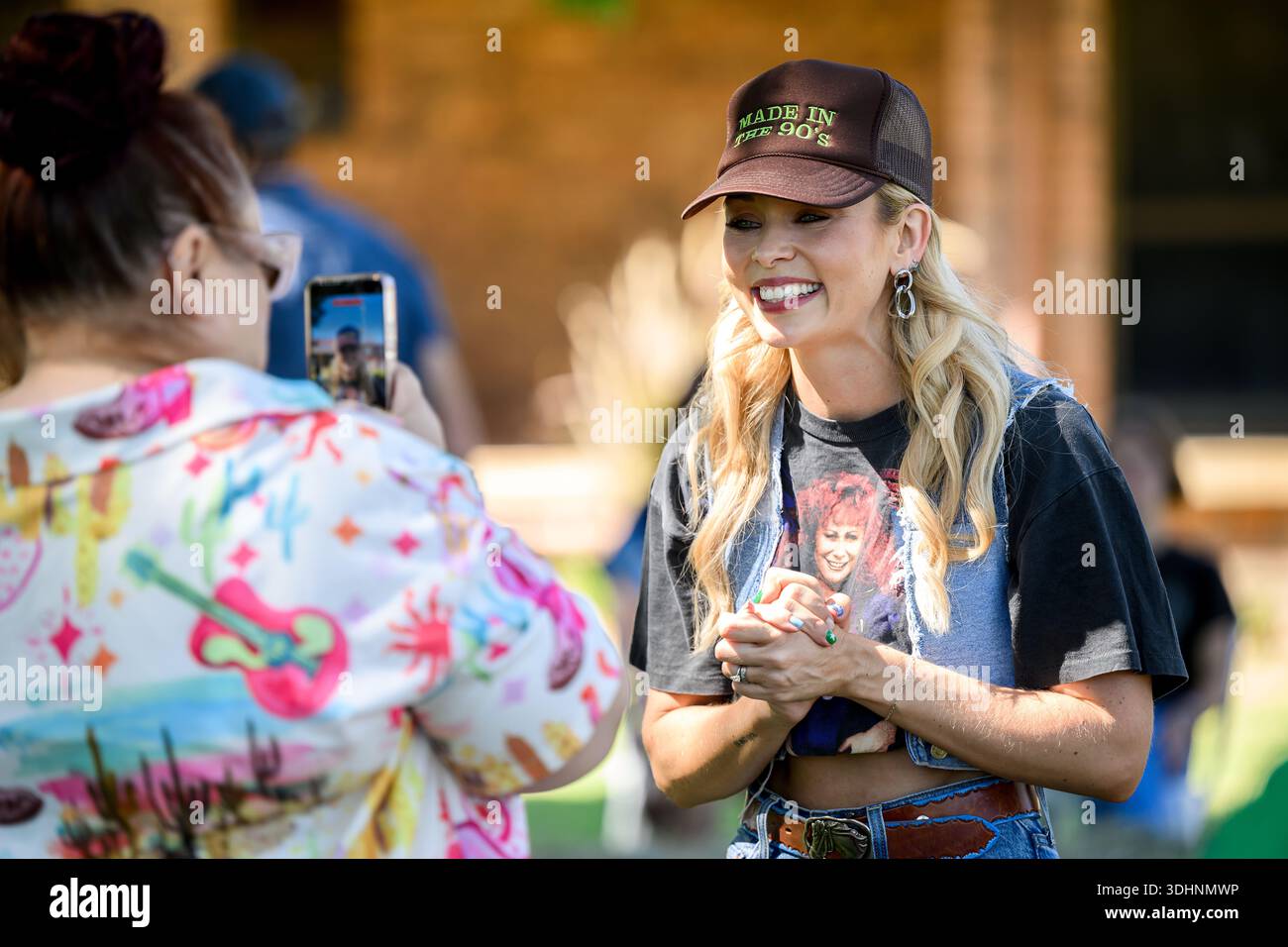 Country singer-songwriter Max Jackson (right) meets fans during the ...