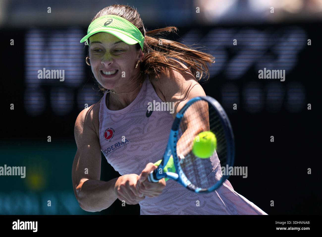 Zeynep Sonmez of Turkey plays a backhand return to Yulia Putintseva of ...