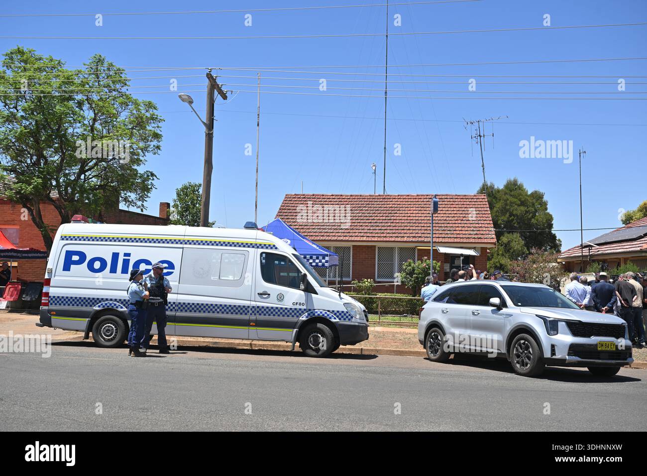 NSW Police are seen at the police station in Lake Cargelligo, Friday ...