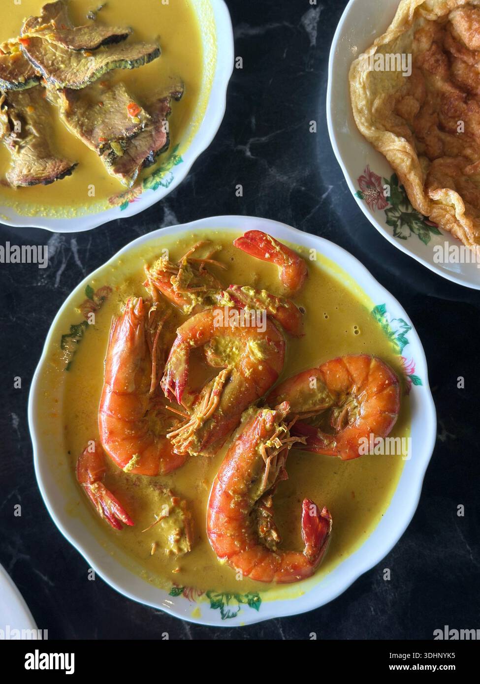 Authentic Malaysian-style dishes including rice, egg, turmeric curry ...